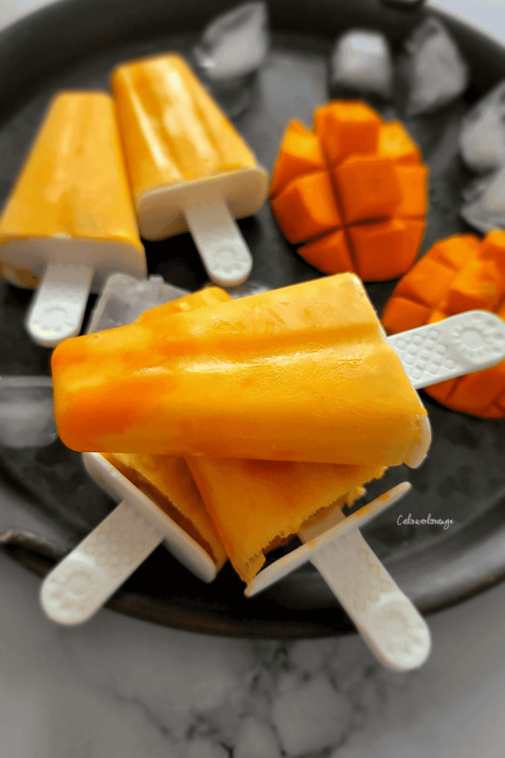 Creamy Mango Popsicles - Cakeworkorange